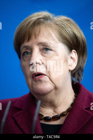 President of Kyrgyzstan, and the German Chancellor Angela Merkel give a ...