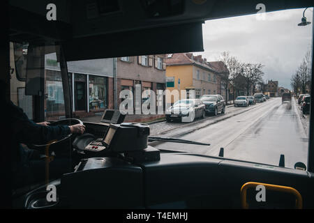 Modern bus interior with drivers hand Stock Photo - Alamy