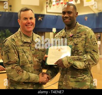 Col. James G. Kent (right), commander, 4th Sustainment Brigade, leads ...