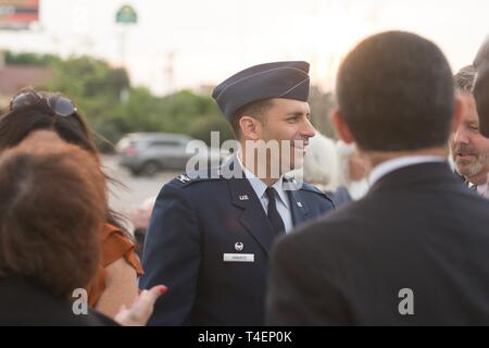 Col. Jason Janaros, 37th Training Wing, commander, speaks with other distinguished guests prior ...