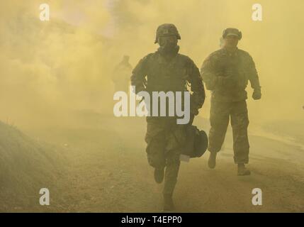U.S. Army Spc. Edward Logel, right, a military policeman assigned to ...