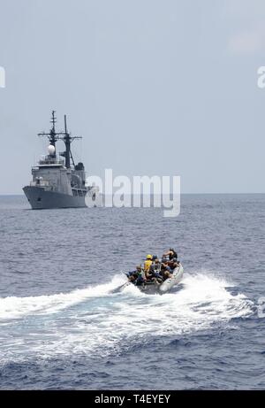 A Philippine Navy Rigid-Hulled Inflatable Boat (RHIB) left is lifted ...