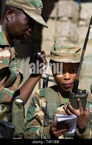 Soldiers from the Zambian Defense Force and United States Army provide ...