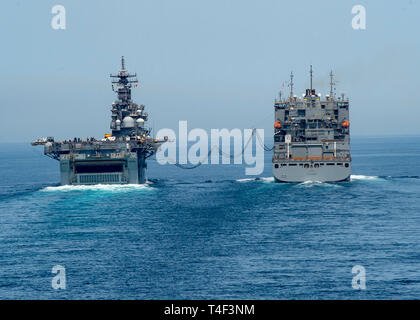 The amphibious cargo ship USS ST. LOUIS (LKA-116) lies at anchor in the ...