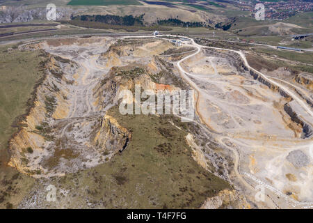 Aerial view of an open pit limestone mining quarry showing the ...