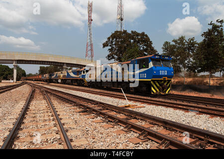 Rail head operations at mine with new wagons on train being loaded with ...