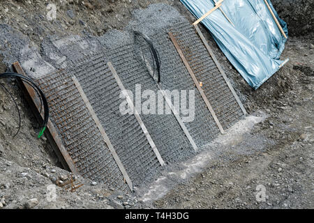 slab concrete and rebar iron for slope reinforcement at an excavation ...