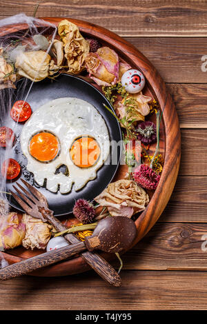 Fried eggs in the shape of a skull. Halloween breakfast Stock Photo - Alamy