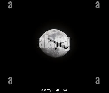 Commercial Airliner Passing in Front of Full Moon at Night (1 of 3 ...