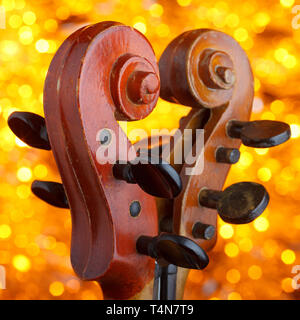 Two violin scrolls Stock Photo - Alamy