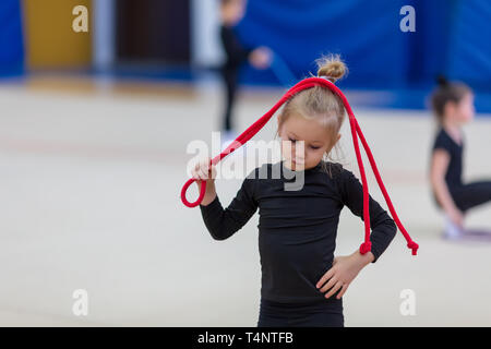 Little gymnast with skipping rope Stock Photo - Alamy