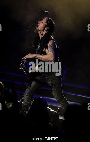 Dan Donegan and John Moyer and band Disturbed seen performing on stage ...