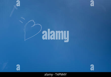 Skywriting at Easter with Jesus is love symbols on a blue sky Stock ...