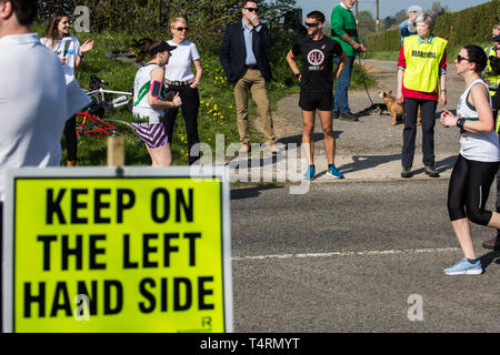 Maidenhead, UK. 19th April, 2019. A runner takes a selfie with Prime ...