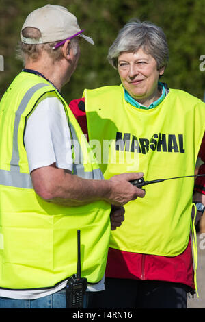 Maidenhead, UK. 19th April, 2019. Prime Minister Theresa May acts as a ...