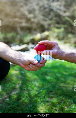easter egg tapping, close up of two hands egg tapping, mother and son ...