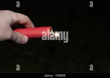 Fireworks, firecracker with a burning fuse Stock Photo - Alamy