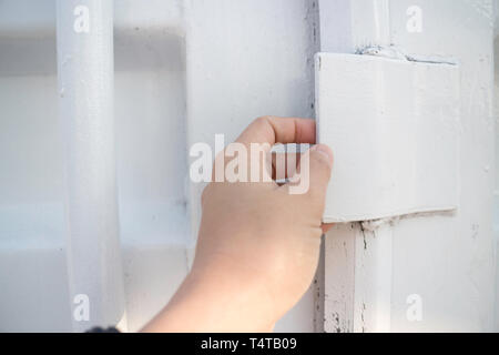 Hand on cargo container door, stock photo Stock Photo - Alamy