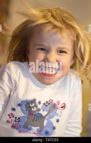 Portrait of caucasian girl of six years looking at camera on white ...