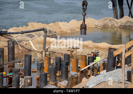 River bank revetment construction site. Welding industrial construction ...