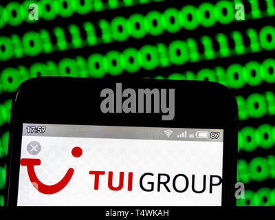 In this photo illustration a TUI Group logo seen displayed on a smart ...