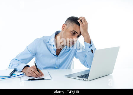 Office Environment - Frustrated overworked office worker at her desk ...