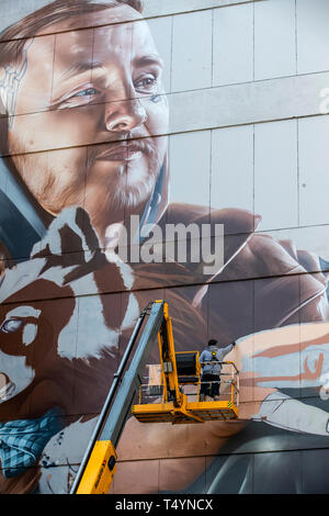 Street artist Sam Bates, aka Smug, creates a new mural for this year's ...