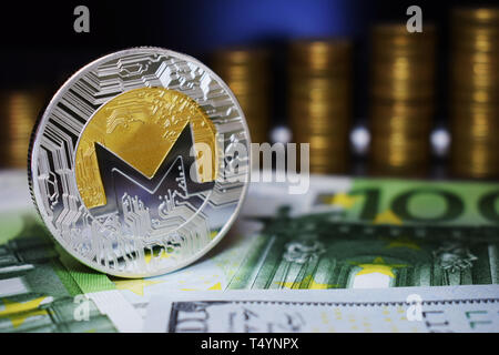Coin physical Monero XMR on green banknote, background from golden ...