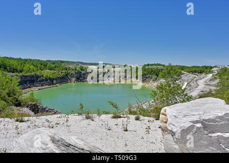 A rock quarry filled with water Stock Photo - Alamy