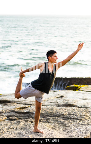 Young man with Tibetan singing bowl at home Stock Photo - Alamy