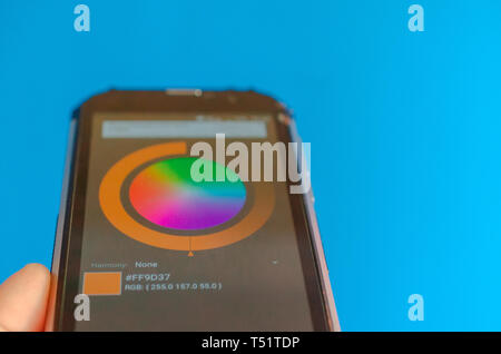 Electronic color palettes between a smartphone and a laptop Stock Photo ...