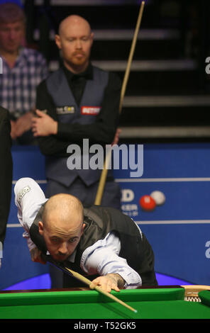 Luca Brecel plays a shot during his match against Judd Trump, on day ...