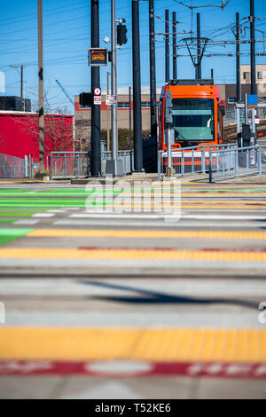 Modern streetcar near tram stop sign outdoors Stock Photo - Alamy