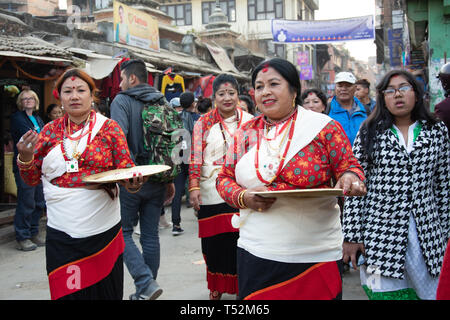 Men Newari in traditional dress at the bell of Mahendreshwar Temple ...
