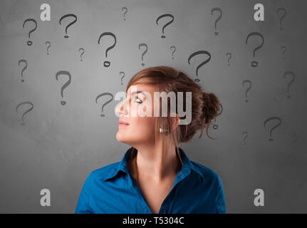 Person with question marks around face Stock Photo - Alamy