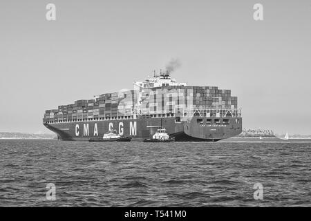 Arriving cargo container freighter ship stacked with load of shipping ...