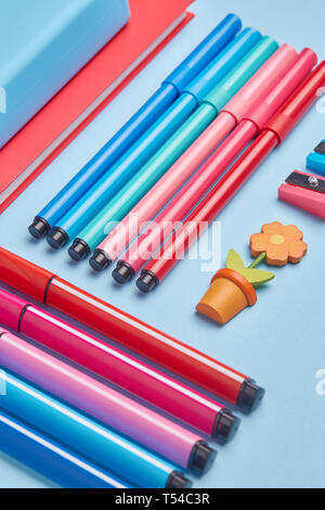 Orange calculator on a bright blue paper background. Office supplies ...