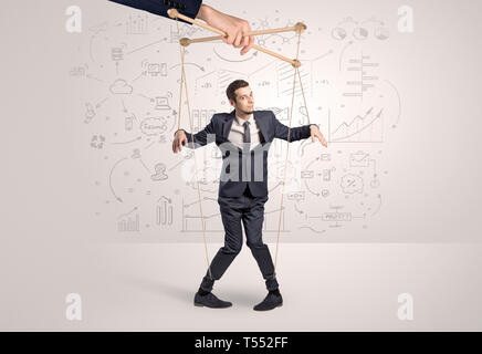 Little businessman controlled from above like a puppet concept Stock ...