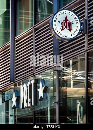 Pret a Manger - A sign and star logo outside a Pret a Manger coffee and ...