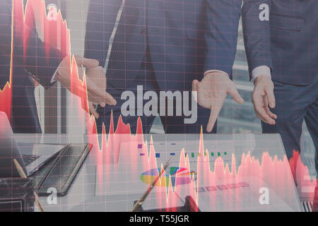 Business concept. Against the background of graphs and charts, a yellow ...