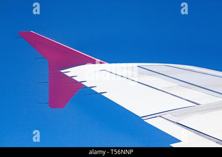 pink airplane wings on blue sky - freedom and travel concept Stock ...