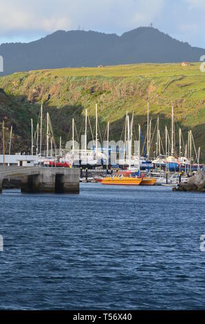 Yachts moored at the marina of Vila do Porto, administrative centre of ...