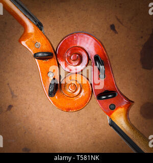 Two violin scrolls Stock Photo - Alamy