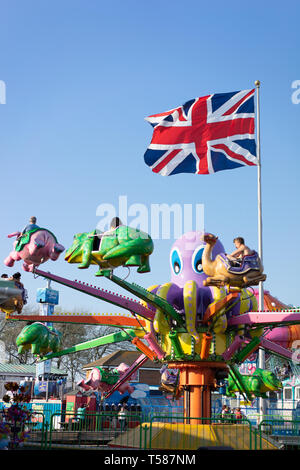 Funfair ride at Littlehampton amusement park in England on a summers ...