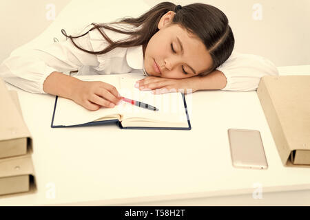 Fall asleep on lesson. Girl child fall asleep while reading book table ...