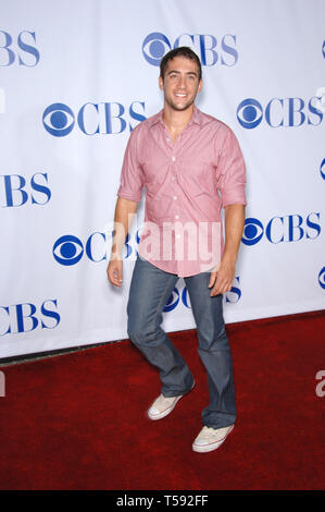 CSI Miami star Jonathan Togo leans to place a note of prayer into a ...