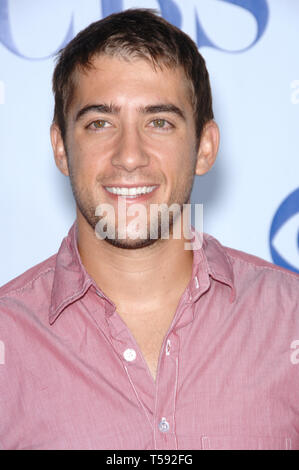 CSI Miami star Jonathan Togo leans to place a note of prayer into a ...