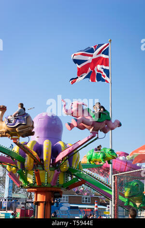 Funfair ride at Littlehampton amusement park in England on a summers ...