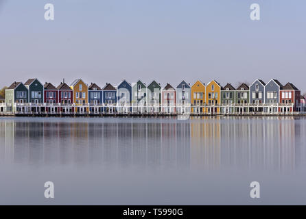 Colorful rainbow houses at a lakeside in Houten, Netherlands Stock ...