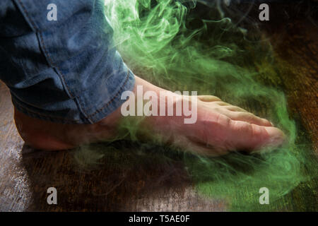 Male smelly foot with colorful visible odor vapor Stock Photo - Alamy